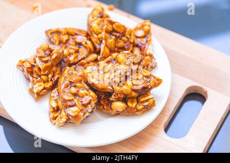 Brazilian peanut-based caramelized sweet that in Brazilian Portuguese ...