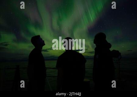 The aurora borealis is seen from the USCGC Bear (WMEC 901) as it ...