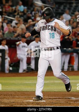 Arizona Diamondbacks' Carson Kelly (18) hits against the Philadelphia ...