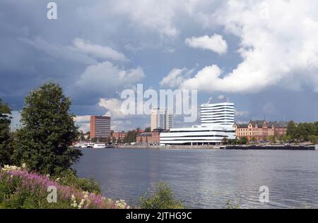 UMEÅ, SWEDEN ON JULY 14, 2021. Old classic cars cruising on a country ...