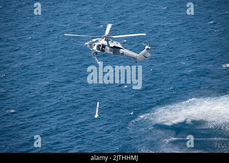 An Airborne Mine Neutralization System (AMNS) detonates in Pyramid Cove ...