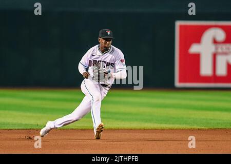 Arizona Diamondbacks shortstop Geraldo Perdomo, center, blocks second ...