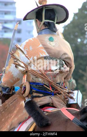 Yabusame (Japanese horseback archery) archers ride towards the starting ...