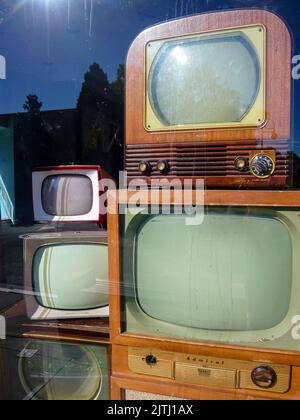 Old fashioned television shop with an old wooden television in the ...