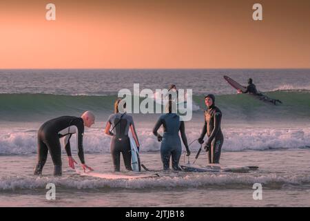 The sun sets in the west at the end of a beautiful November day in ...