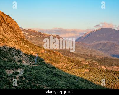 View towards the Tholos of Delphi, Temple of Athena Pronaia, sunset ...