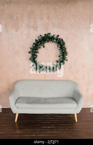 Interior of living room with Christmas wreath, fireplace and fir tree ...