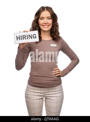 happy female shop assistant with hiring banner Stock Photo - Alamy