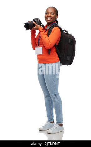 woman photographer with camera and conference id Stock Photo - Alamy