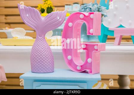 Mermaid tail party decoration with a letter G on the side in rio de ...