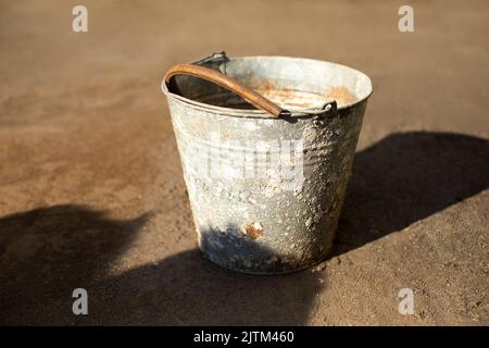 Old bucket outside. Rusty object. Spoiled metal Stock Photo - Alamy