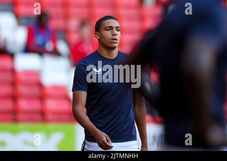 Miles Leaburn of Charlton Athletic on the ball holds off Levi Colwill ...