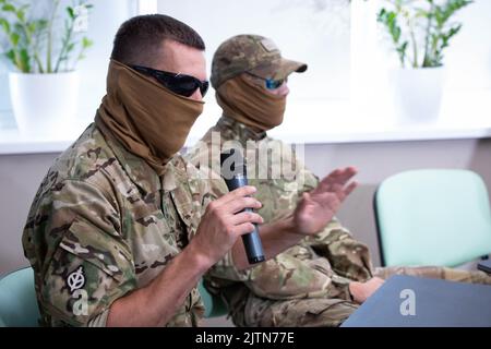 Soldiers of the Russian Legion "Freedom of Russia" attend a forum after ...