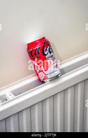 One cola can on heater radiator Stock Photo - Alamy