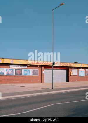 A closed Stagecoach amusement arcade with a high rise building crane ...