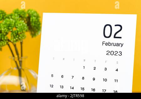 February 2023 Monthly desk calendar for 2023 with diary on wooden table ...