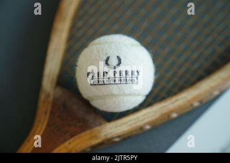 Fred Perry tennis ball and old wooden racket at Wimbledon Championships ...