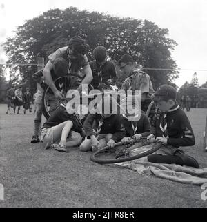 1965, historical, scout rally, sitting on the ground outside in ...