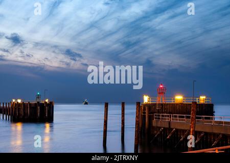 Port entrance in Cuxhaven at the mouth of the Elbe at night, in the ...
