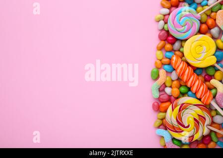Colorful lollipops and different colored round candy isolated on white ...