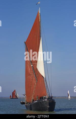 The Thames sailing barge Wyvenhoe in full sail, with Blue Mermaid in ...
