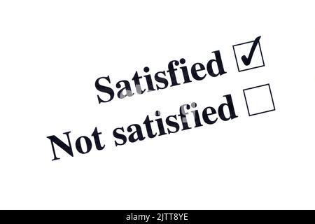 Word satisfied printed in black on white paper, a tickbox is ticked ...