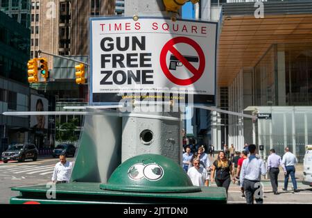 “Gun Free Zone” signs sprout in Times Square in New York on Thursday ...