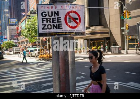 “Gun Free Zone” signs sprout in Times Square in New York on Thursday ...