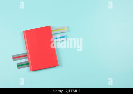 Dyslexia. Top view to red book with colorful reading highlight bookmark ...
