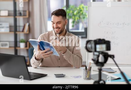 male math teacher having online class at home Stock Photo - Alamy