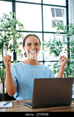 Photo of young excited lady fists hands hooray champion fan lucky ...