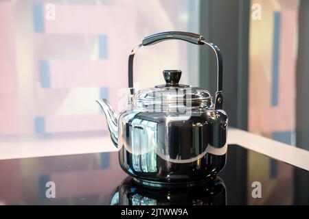 Stainless Water Crow or Vintage Kettle tea pot on electronic stove in ...