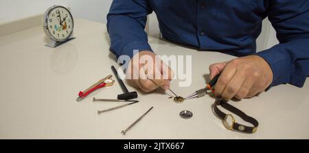 hands of a man while repairing watches. Watchmaker at work Stock Photo ...
