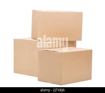 Corrugated cardboard boxes of different sizes are stacked on top of ...