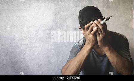 Drug addict reaches for another dose of drug. Concept of addiction ...