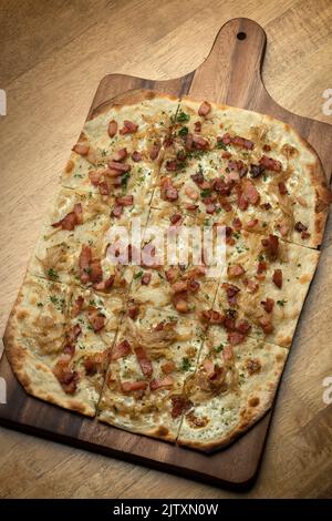 Flammkuchen tarte flambee rectangular pizza with bacon and chicken on ...