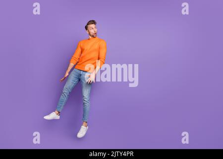 Full body photo of impressed orange hair young lady jump wear green ...