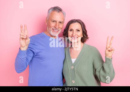 Photo of two positive satisfied partners hands hold bengal light stick ...