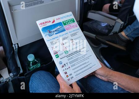 Aircraft passenger safety information card with emergency instructions ...