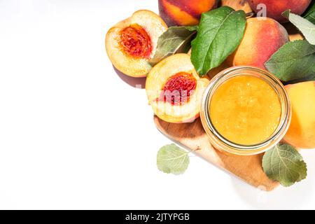 Peach jam in small jar. Homemade autumn peach jam with fresh fruits ...