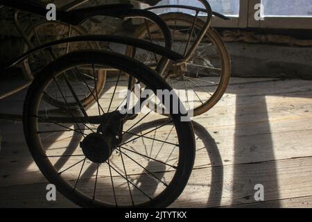 my baby stroller in the attic in sunset Stock Photo - Alamy