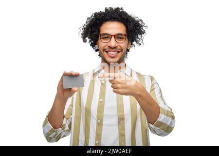 Shopping and finance concept. Young man winning bank prize, showing ...