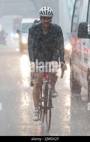 Amber rain catches Londoners this afternoon at Oxford Street. Image ...