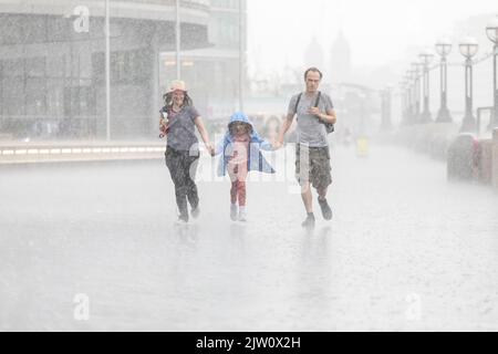 Amber rain catches Londoners this afternoon at Oxford Street. Image ...