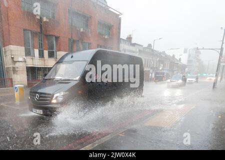 Amber rain catches Londoners this afternoon at Oxford Street. Image ...