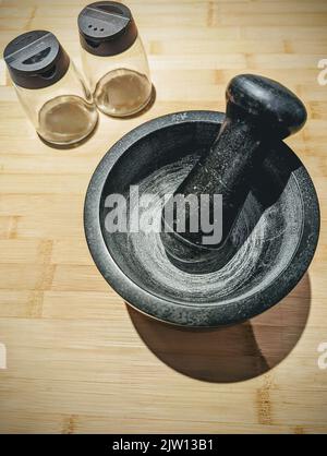 Empty salt, pepper shakers on orange background Stock Photo - Alamy
