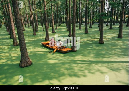 YANGZHOU, CHINA - SEPTEMBER 1, 2022 - Tourists take a boat ride in the ...