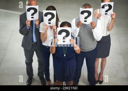 Any questions. High angle shot of a group of businesspeople meeting in ...