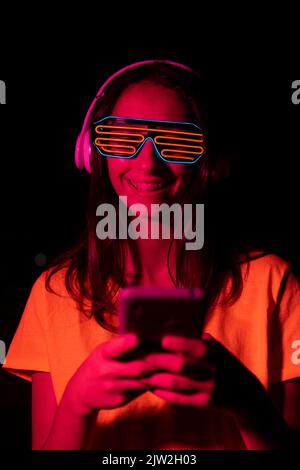 Woman texting on cellphone at night Stock Photo - Alamy