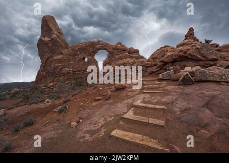 Shabby stairs leading to Turret Arch against cloudy gray sky with ...